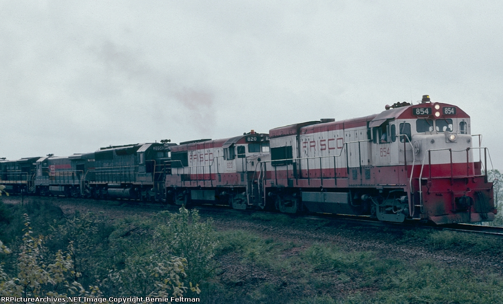 Frisco U30B #854 leads Seaboard Coast Line train #333 southbound away from Manchester. In the ...